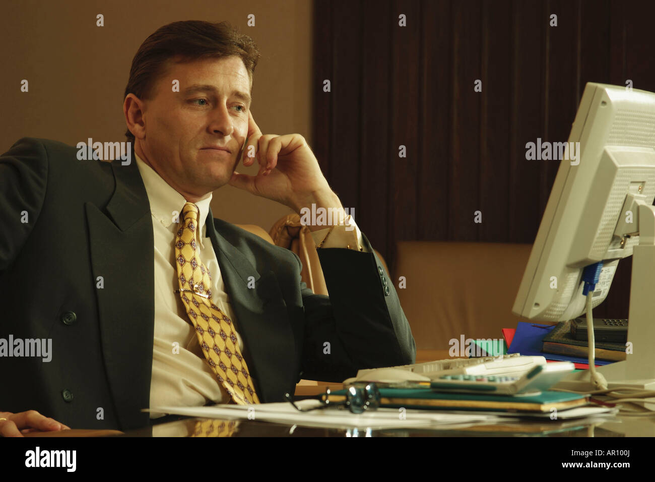 Businessman in office Thinking Stock Photo - Alamy