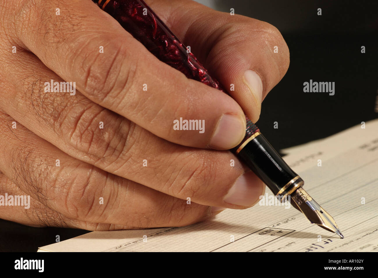 Signing a cheque hi-res stock photography and images - Alamy