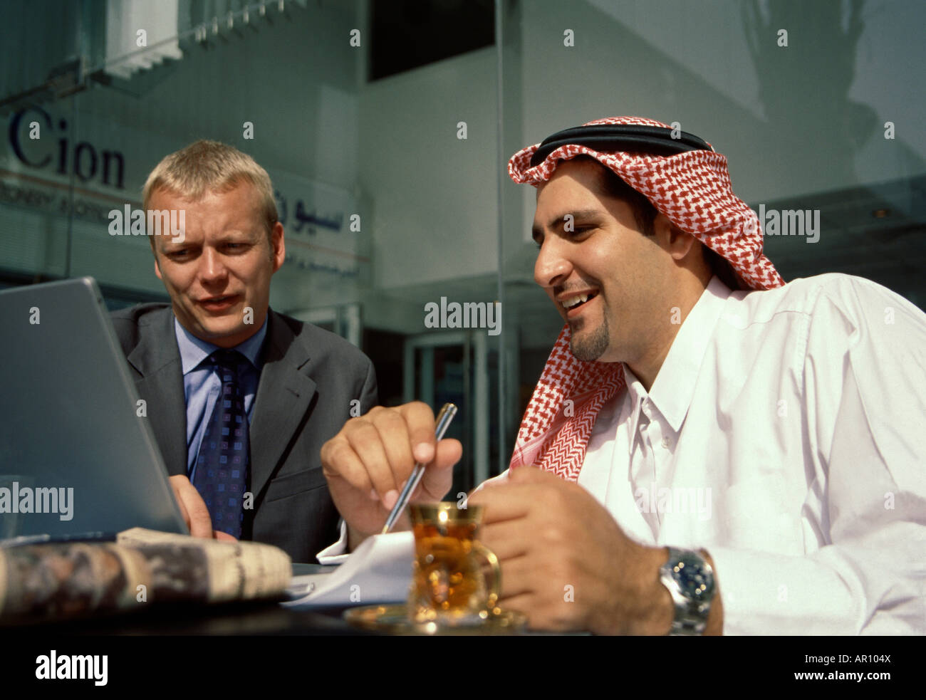 Two Business men at a cafe Discussing Stock Photo - Alamy