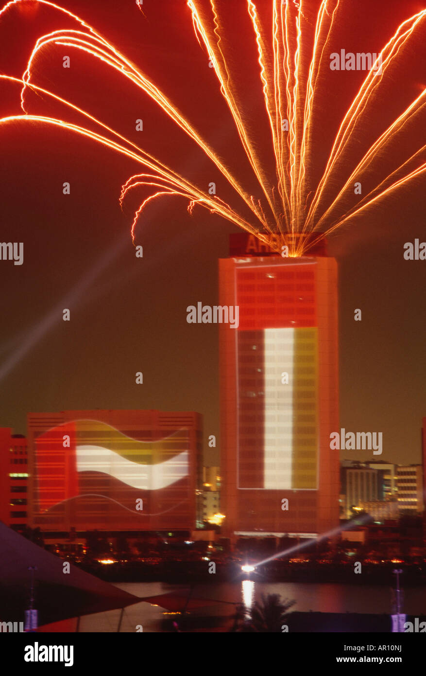 Fireworks seen on top of the building having flag picture on its facade ...