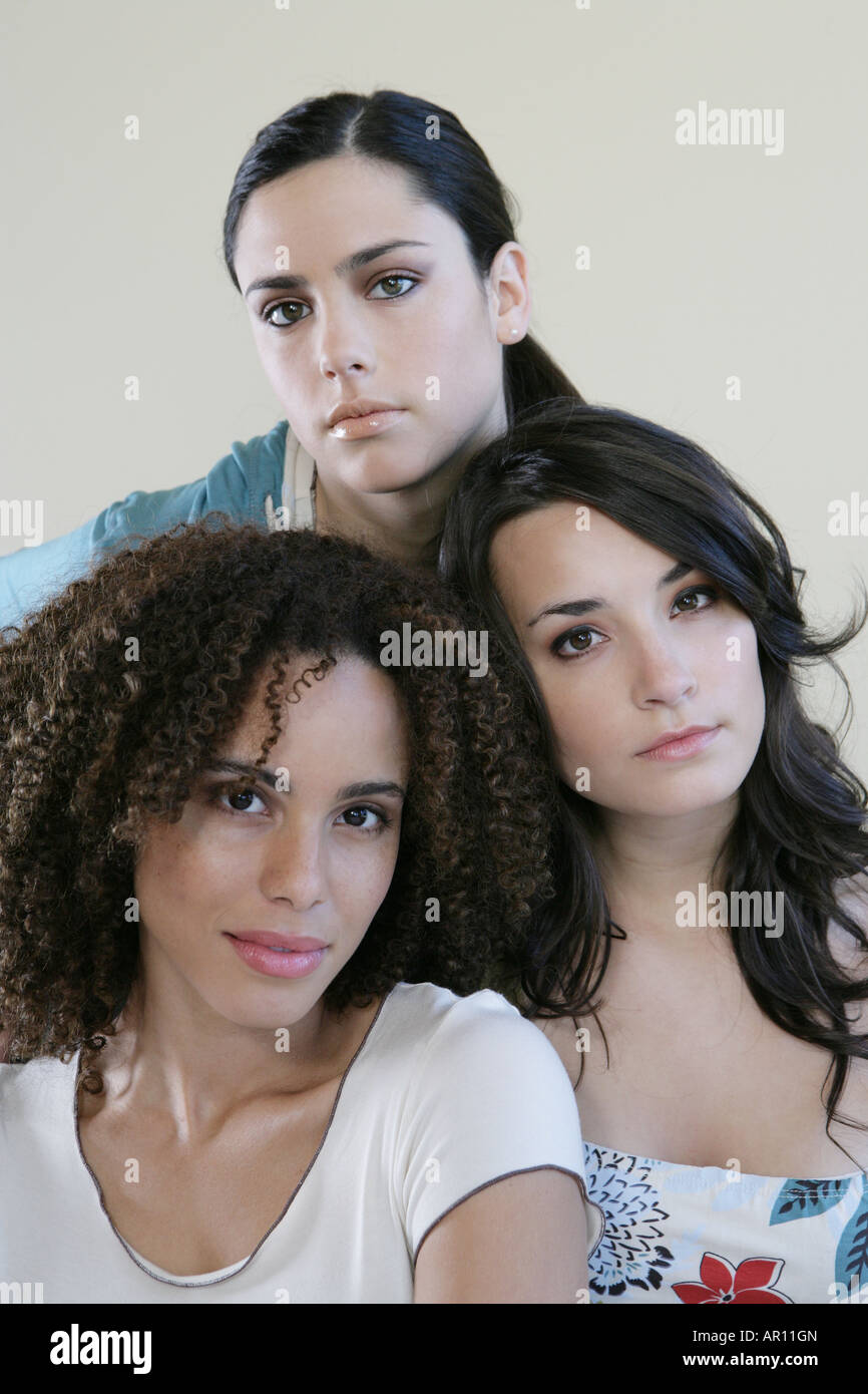 Three women looking at camera Stock Photo - Alamy