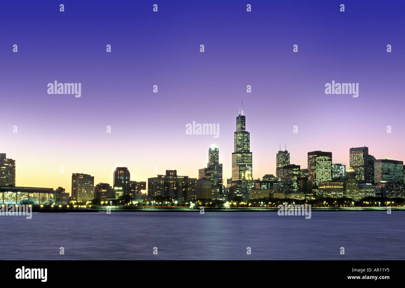 The splendid Chicago Skyline glowing at dusk under a beautiful autumn ...
