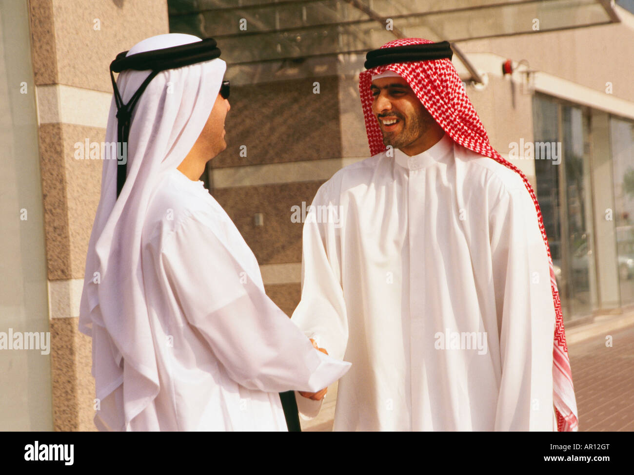 Two arab men greeting other hi-res stock photography and images - Alamy