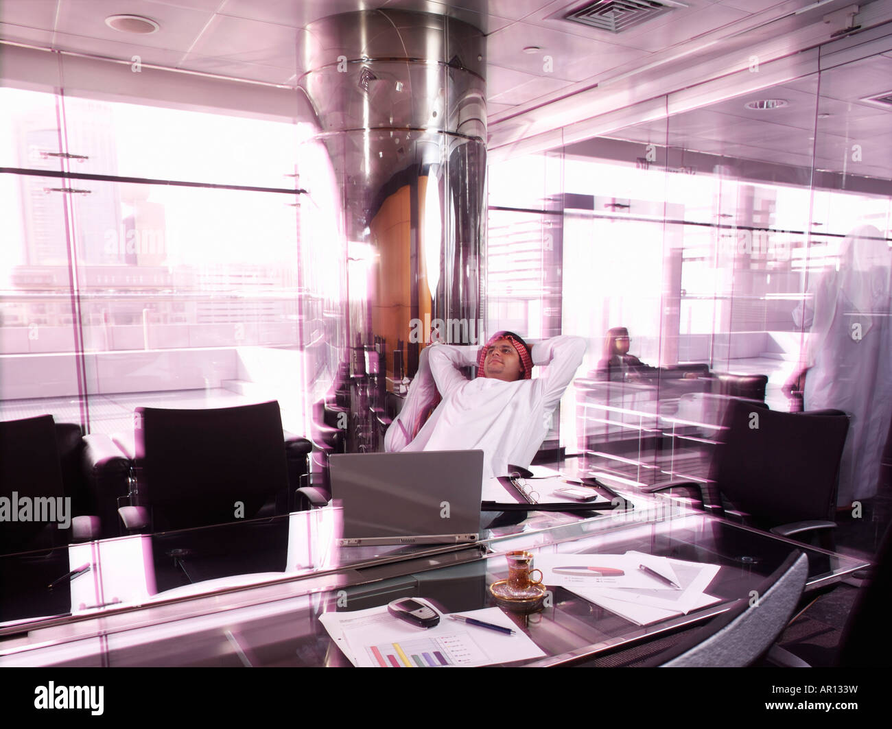 Businessman relaxing in a conference room Stock Photo - Alamy
