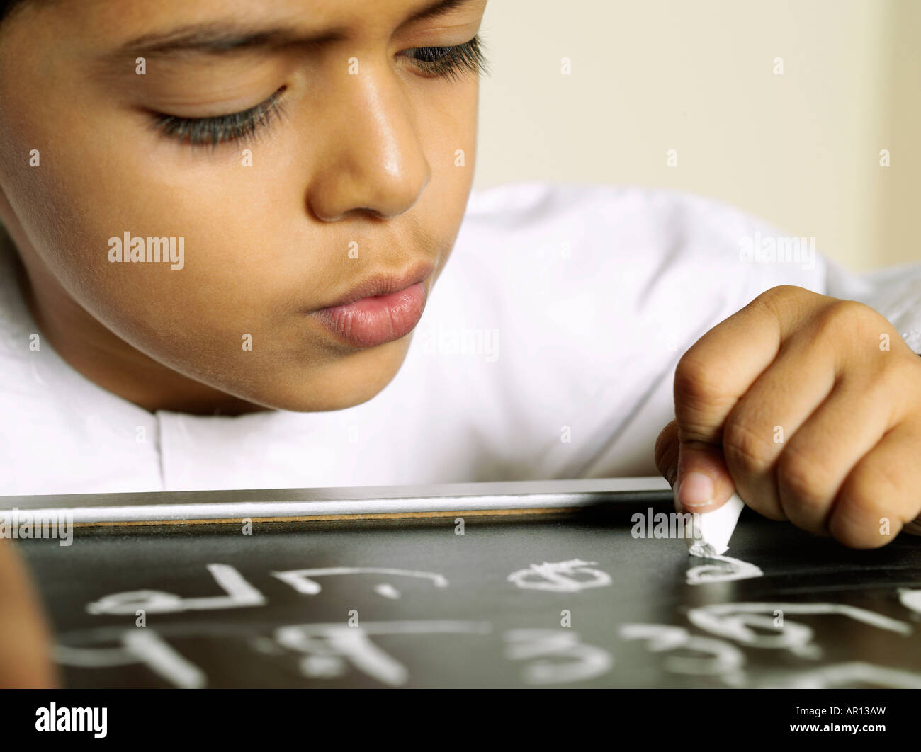 Arab boy writing hi-res stock photography and images - Alamy
