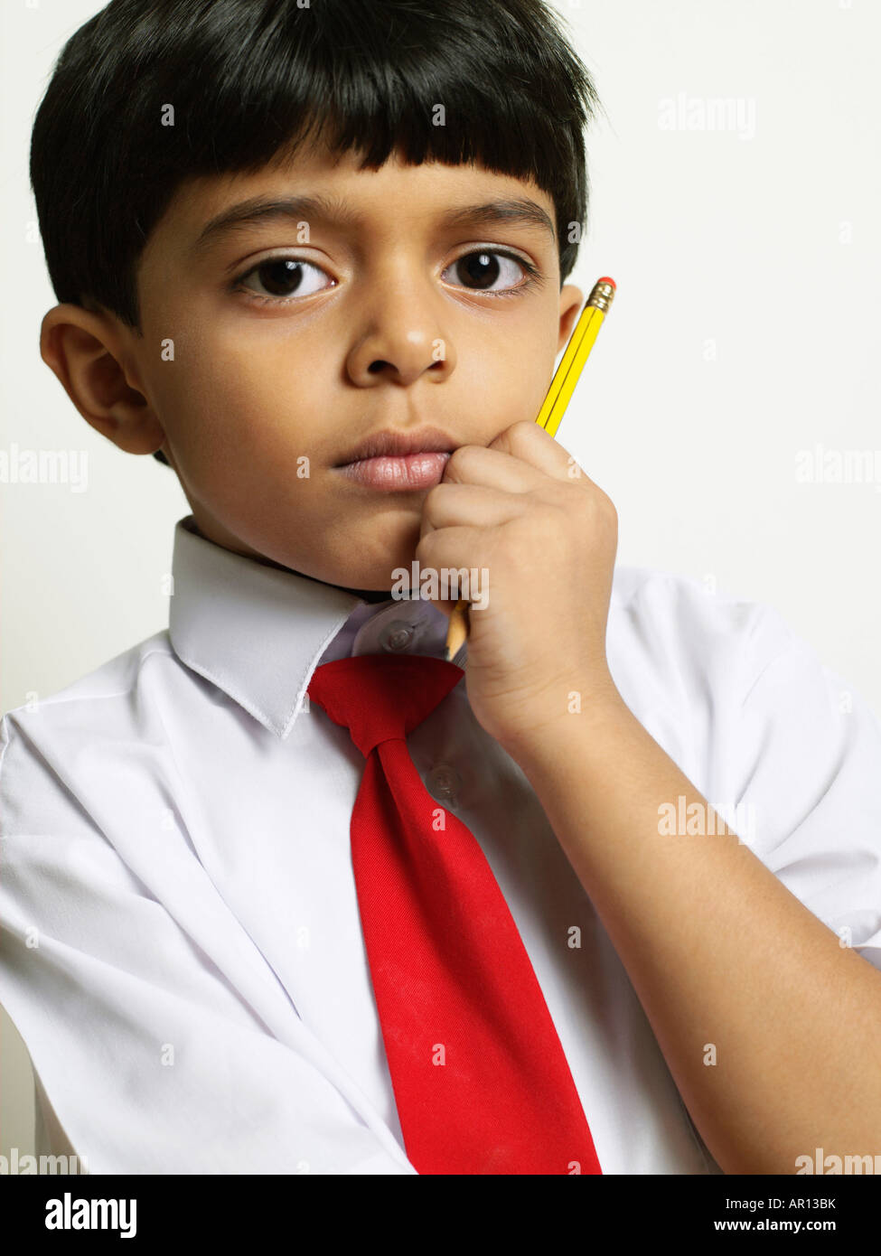 School Boy holding pencil Stock Photo - Alamy