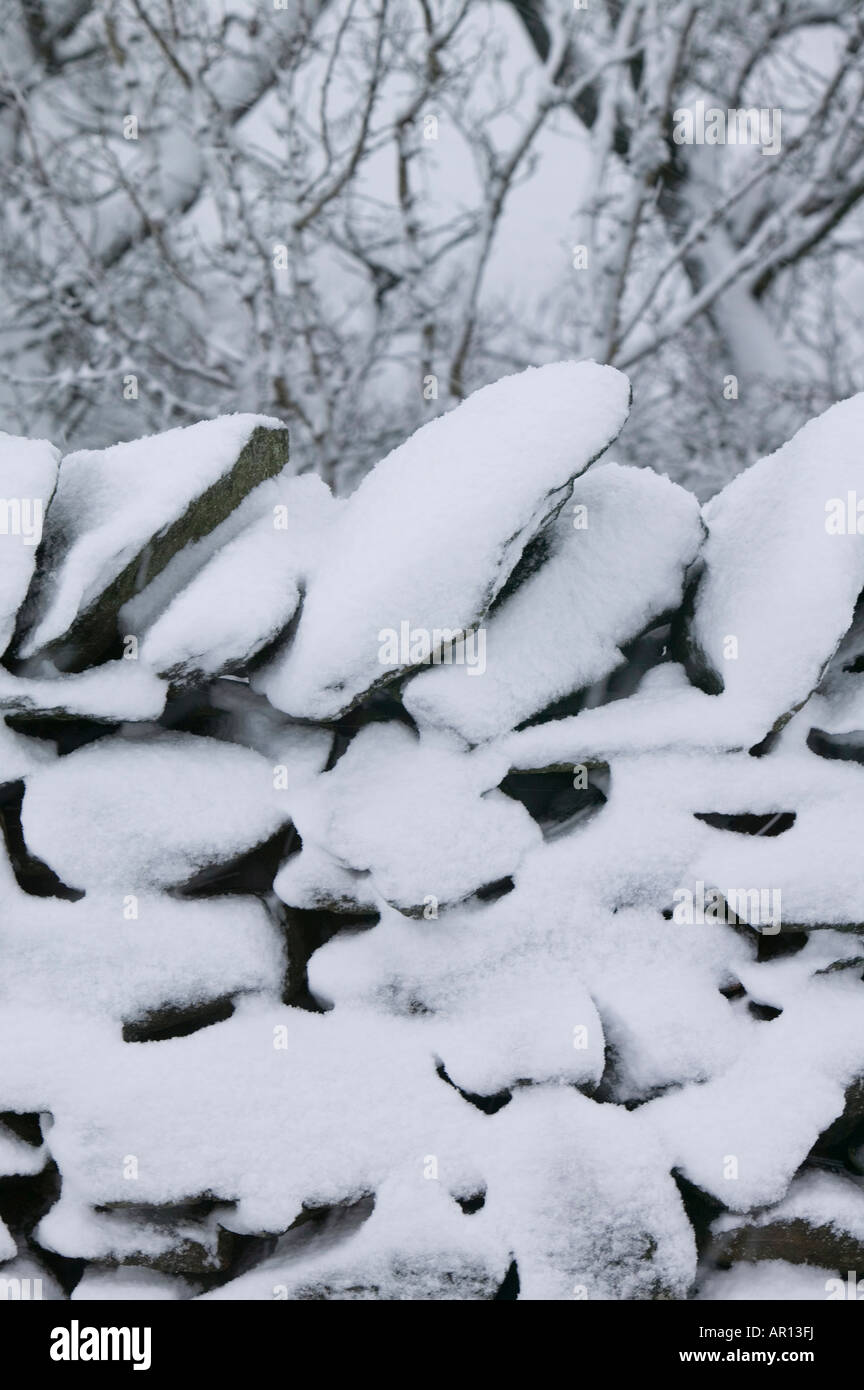 A dry stone wall covered in snow UK Stock Photo - Alamy