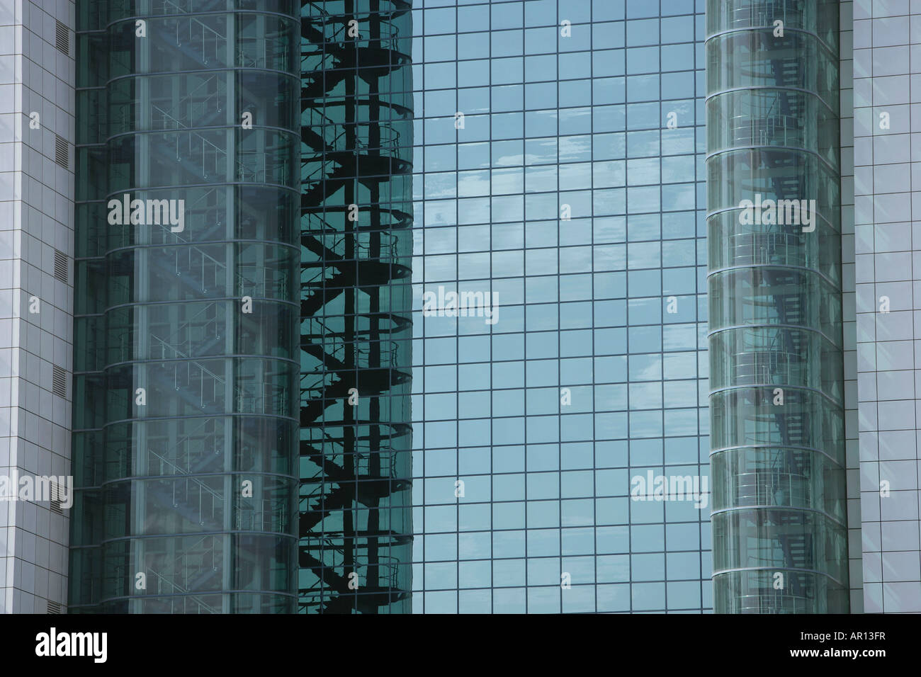 A Close-up of the building where the sky reflects on the glass window ...