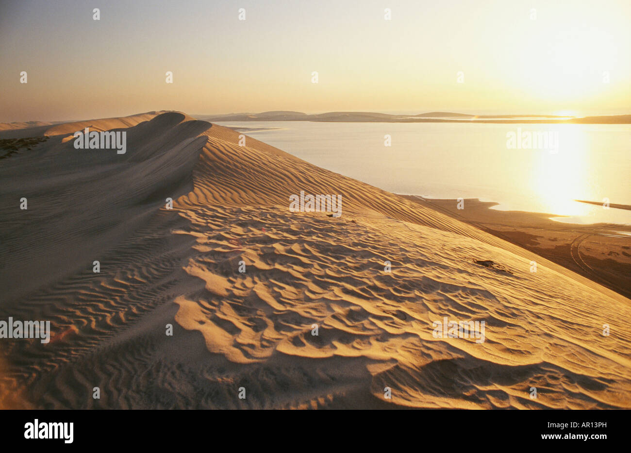 A spectacular view of sunset seen from the sand dunes Stock Photo - Alamy