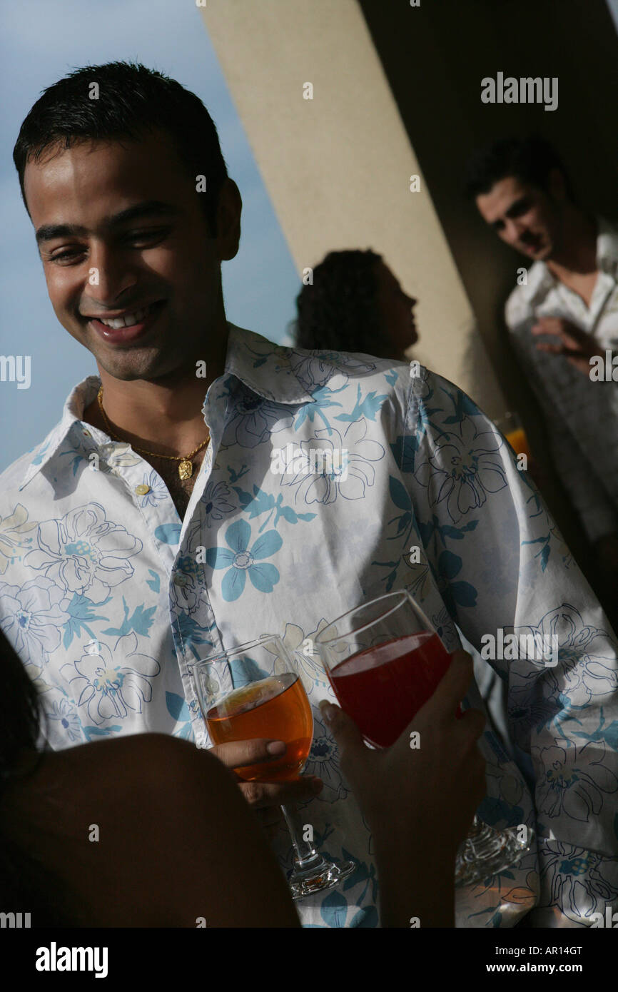 Young people socializing at home Stock Photo - Alamy