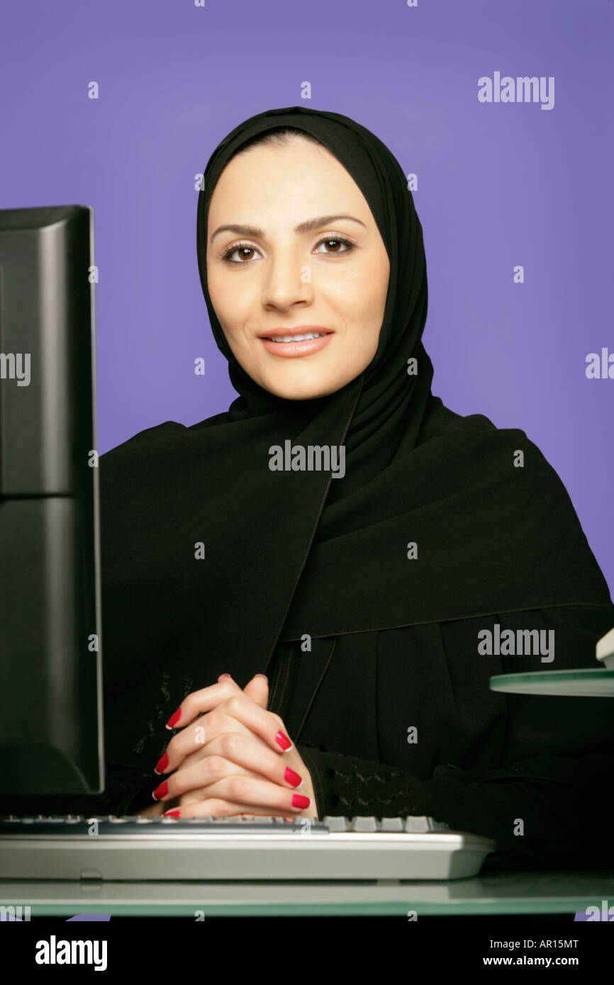 Arab lady busy on the computer Stock Photo - Alamy