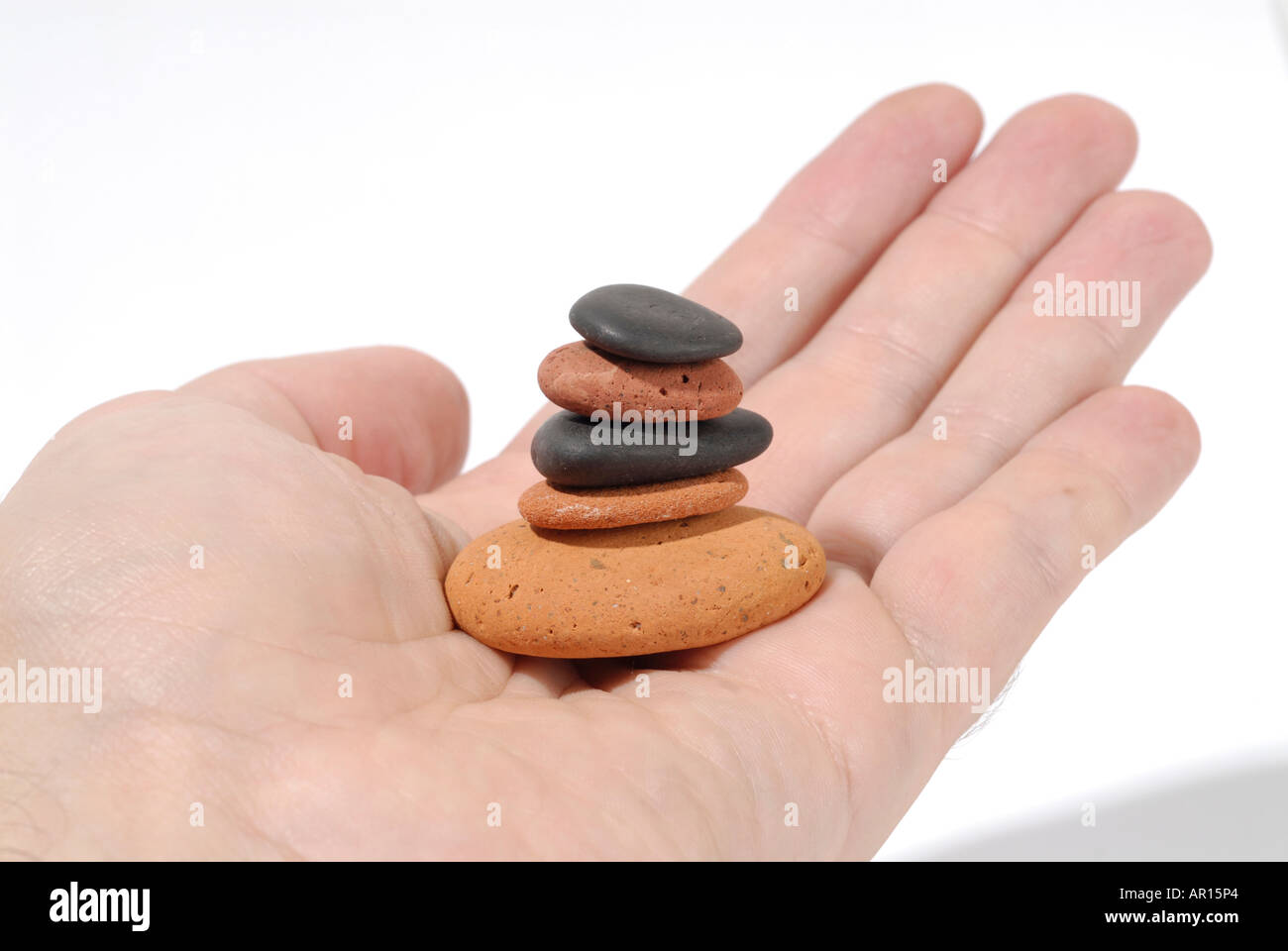 Stones in the hand Stock Photo - Alamy
