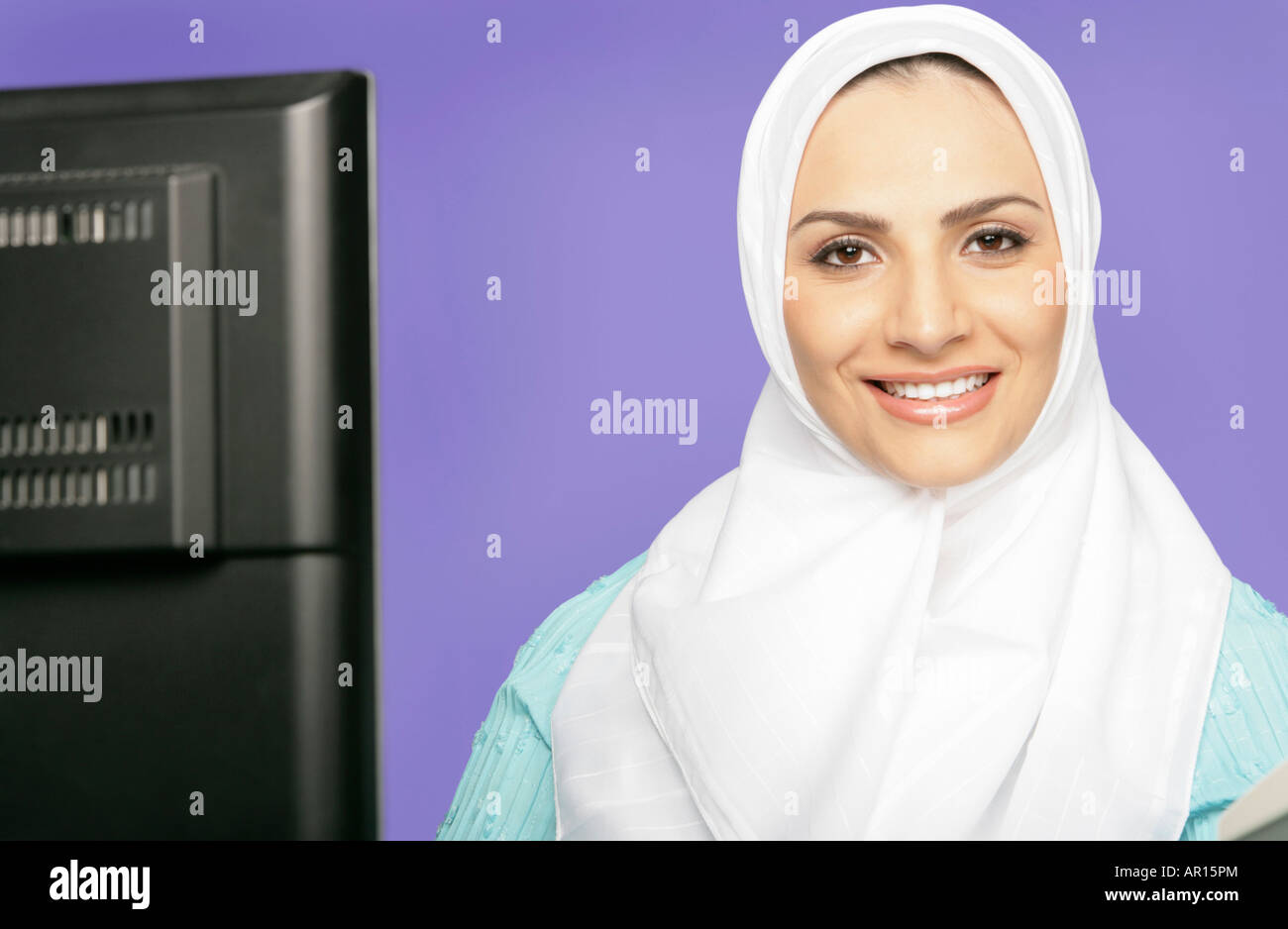 Arab lady busy on the computer Stock Photo - Alamy