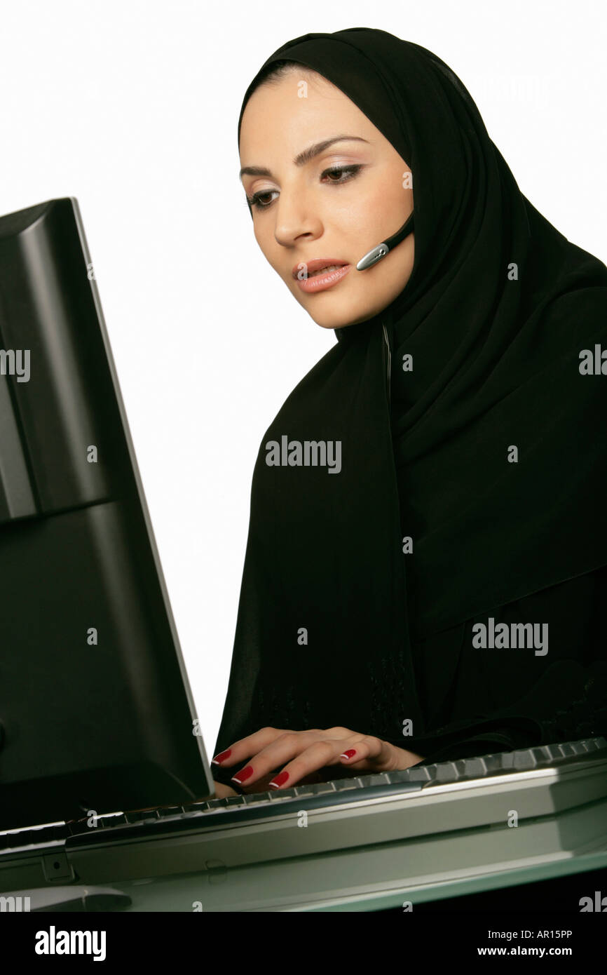 Arab lady busy on the computer Stock Photo - Alamy