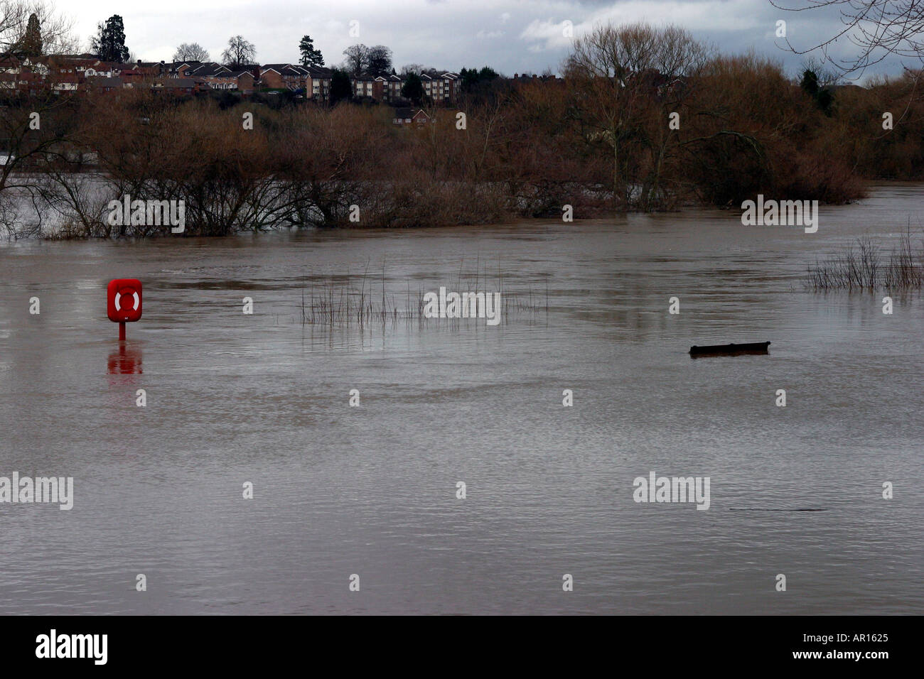 River Wye floods with a life buoy and bench almost totally submerged in ...
