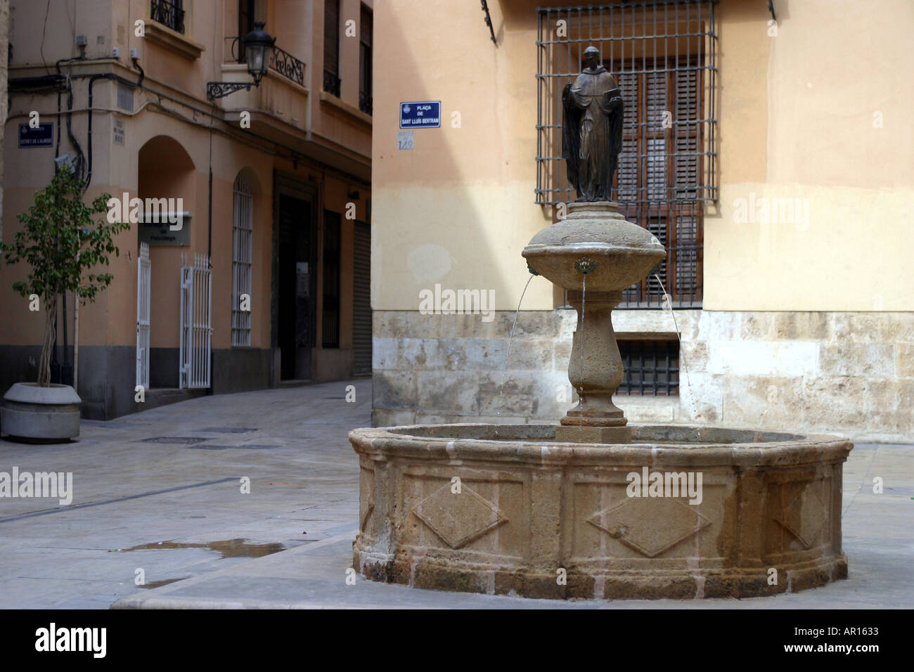 typical Valencian water fountain in a quiet traditional square in the ...