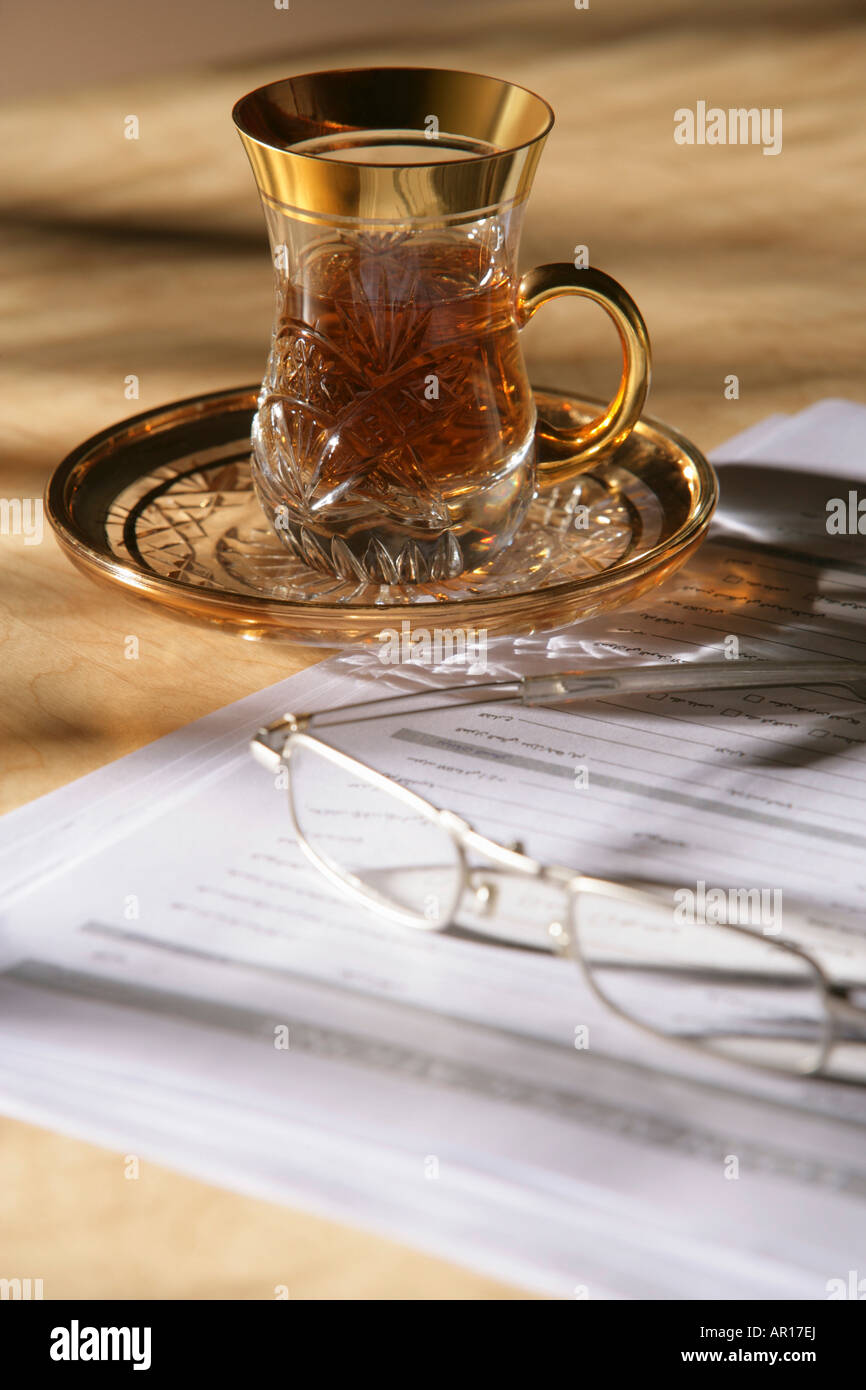 Cups of tea and forms Stock Photo - Alamy