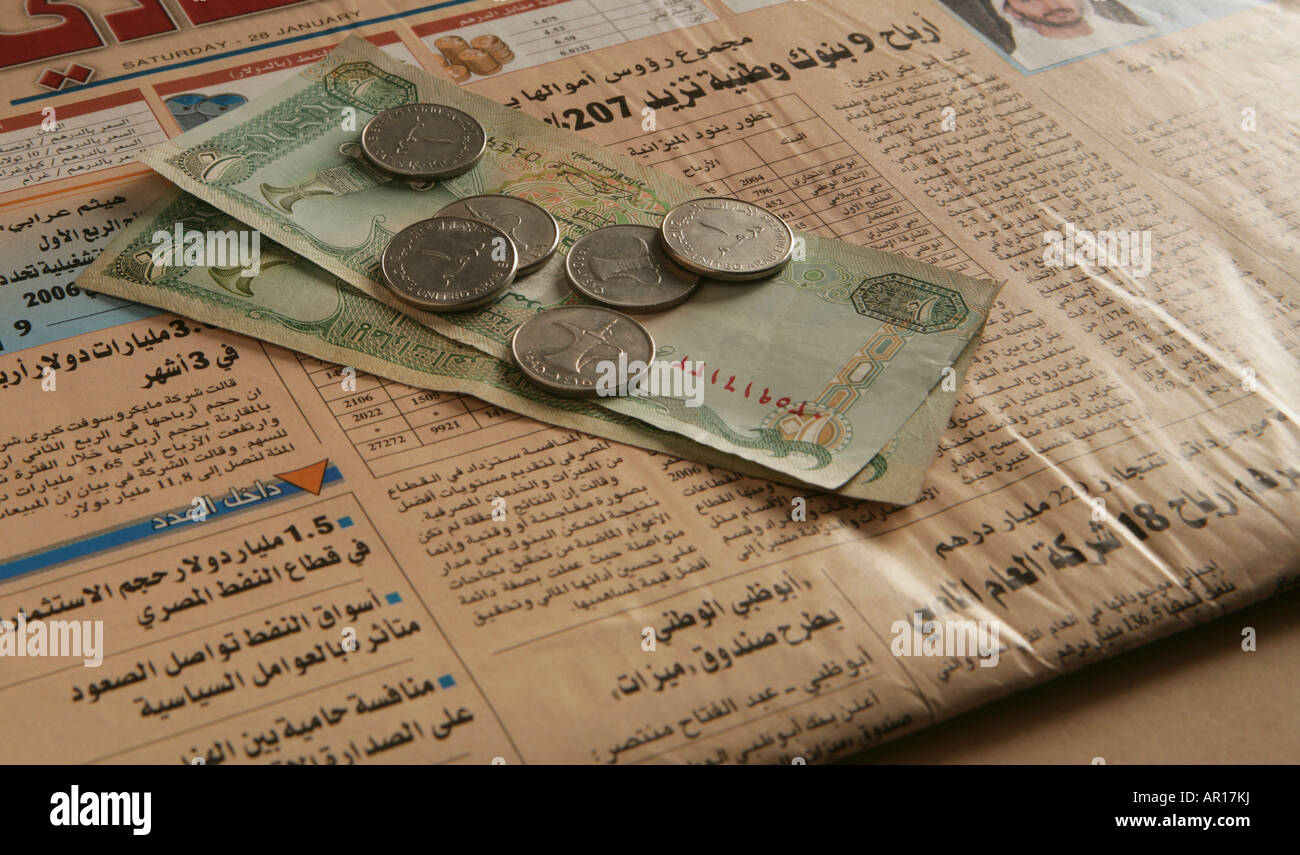 Arab Money on top of newspaper Stock Photo - Alamy