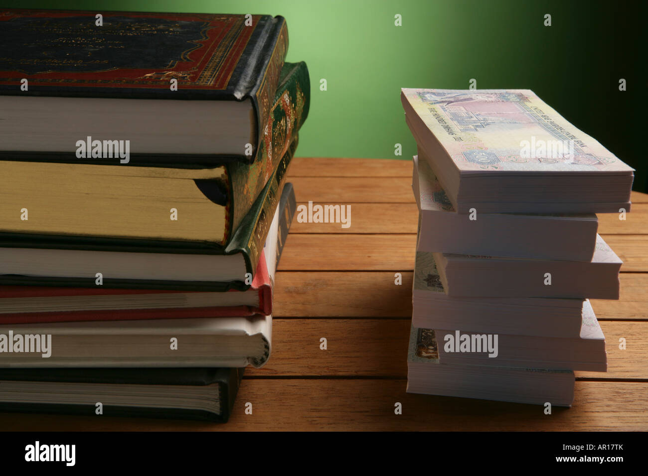 Series of Books and Bundle of Money Stock Photo - Alamy