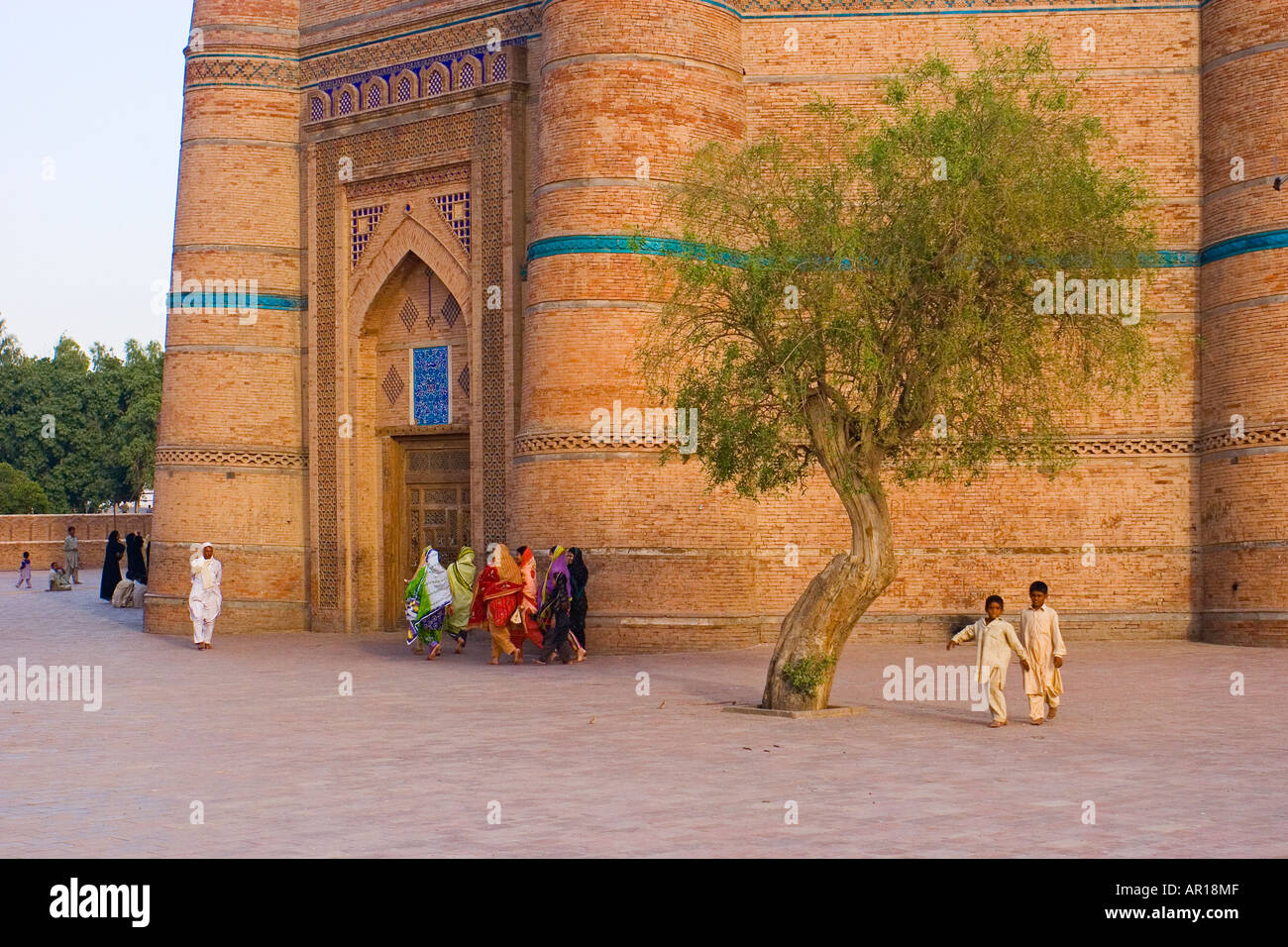 People walking in front of the main mausoleums of historical Multan ...