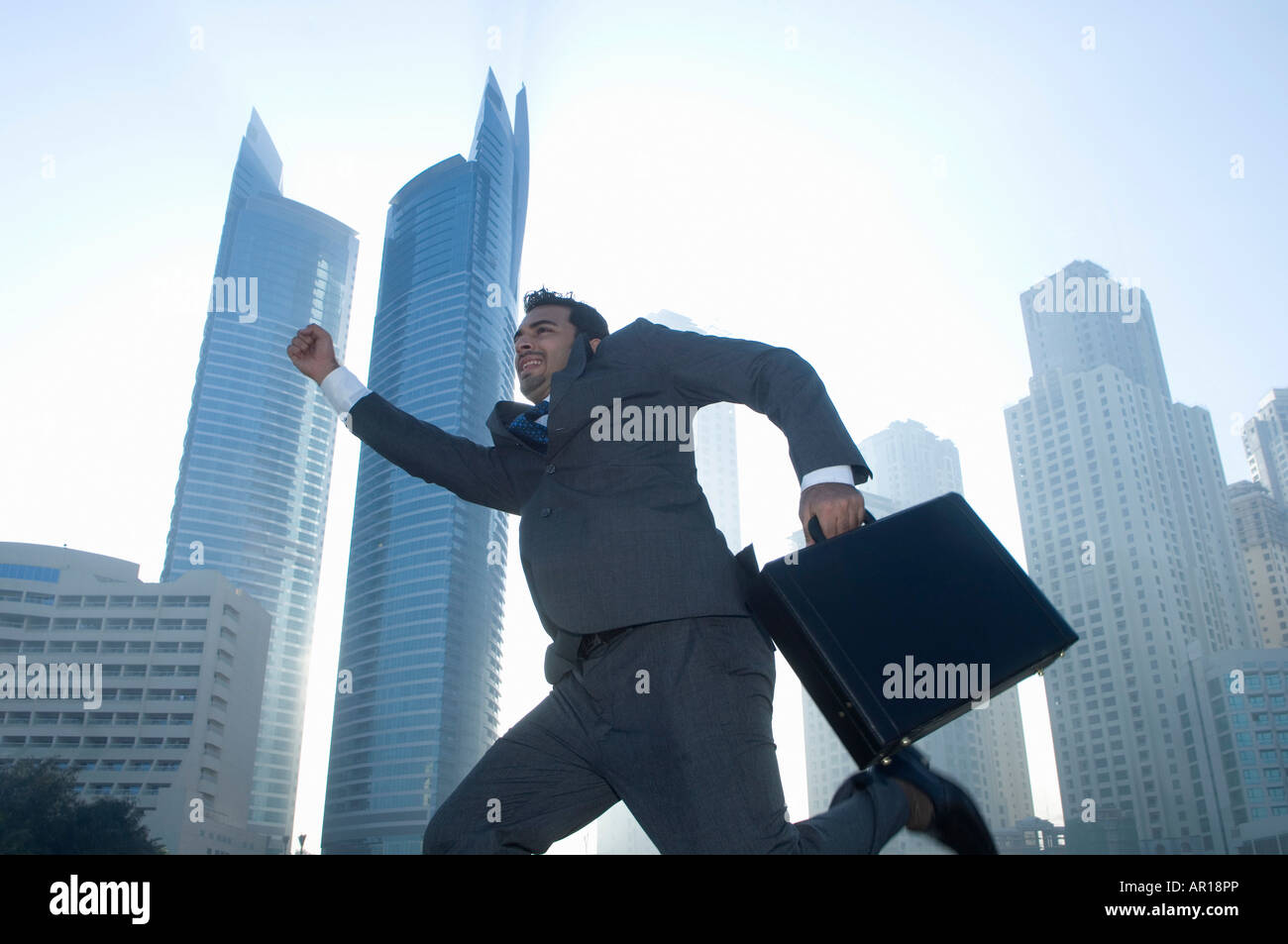 Indian man running in suit hi-res stock photography and images - Alamy