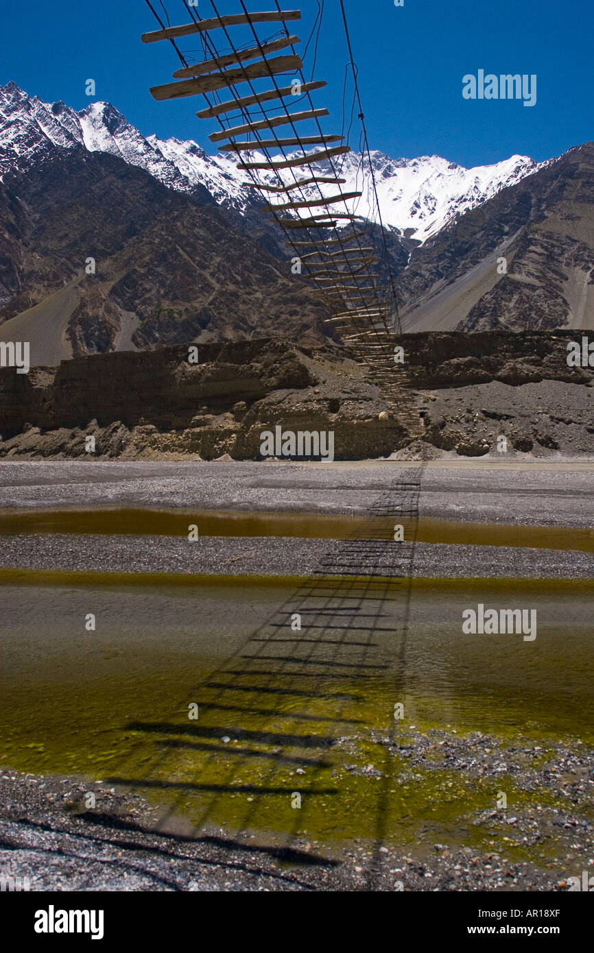 A scary suspension bridge hanging over Hunza river in Passu Pakistan ...