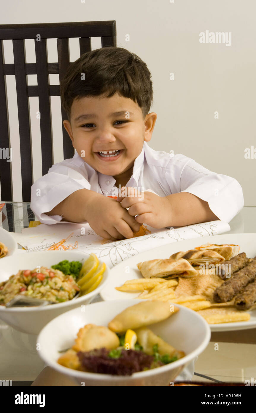 Young Boy eating at the dining table Stock Photo - Alamy