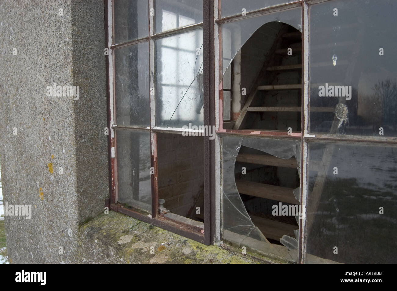 broken windows in abandoned farm buildings in winter snow Stock Photo ...
