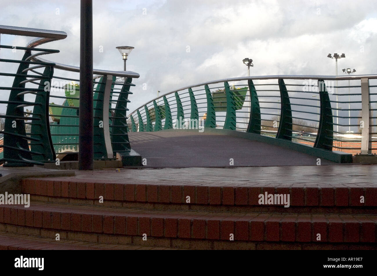 Modern design bridge from shopping centre Stock Photo - Alamy