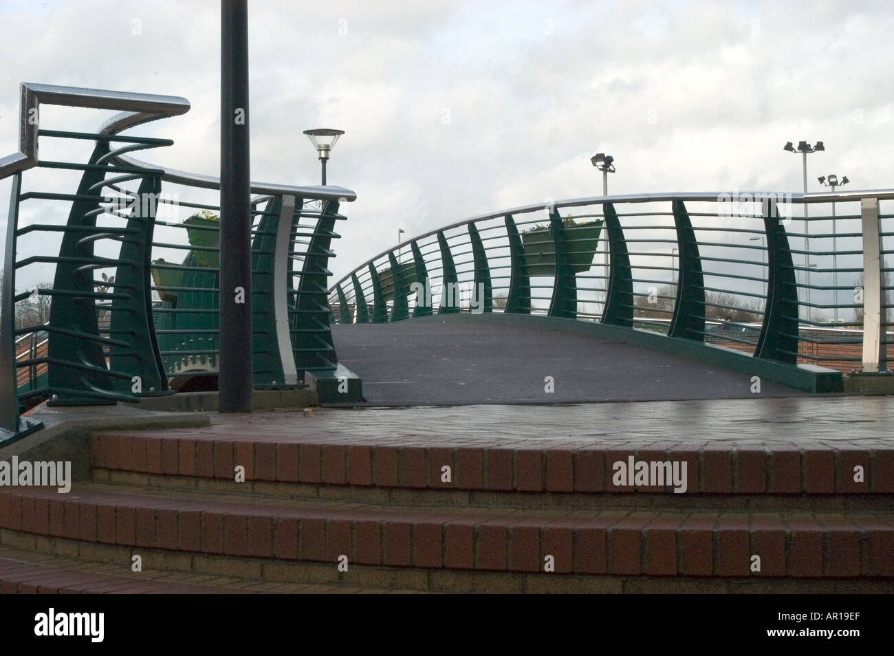 Modern design bridge from shopping centre Stock Photo - Alamy