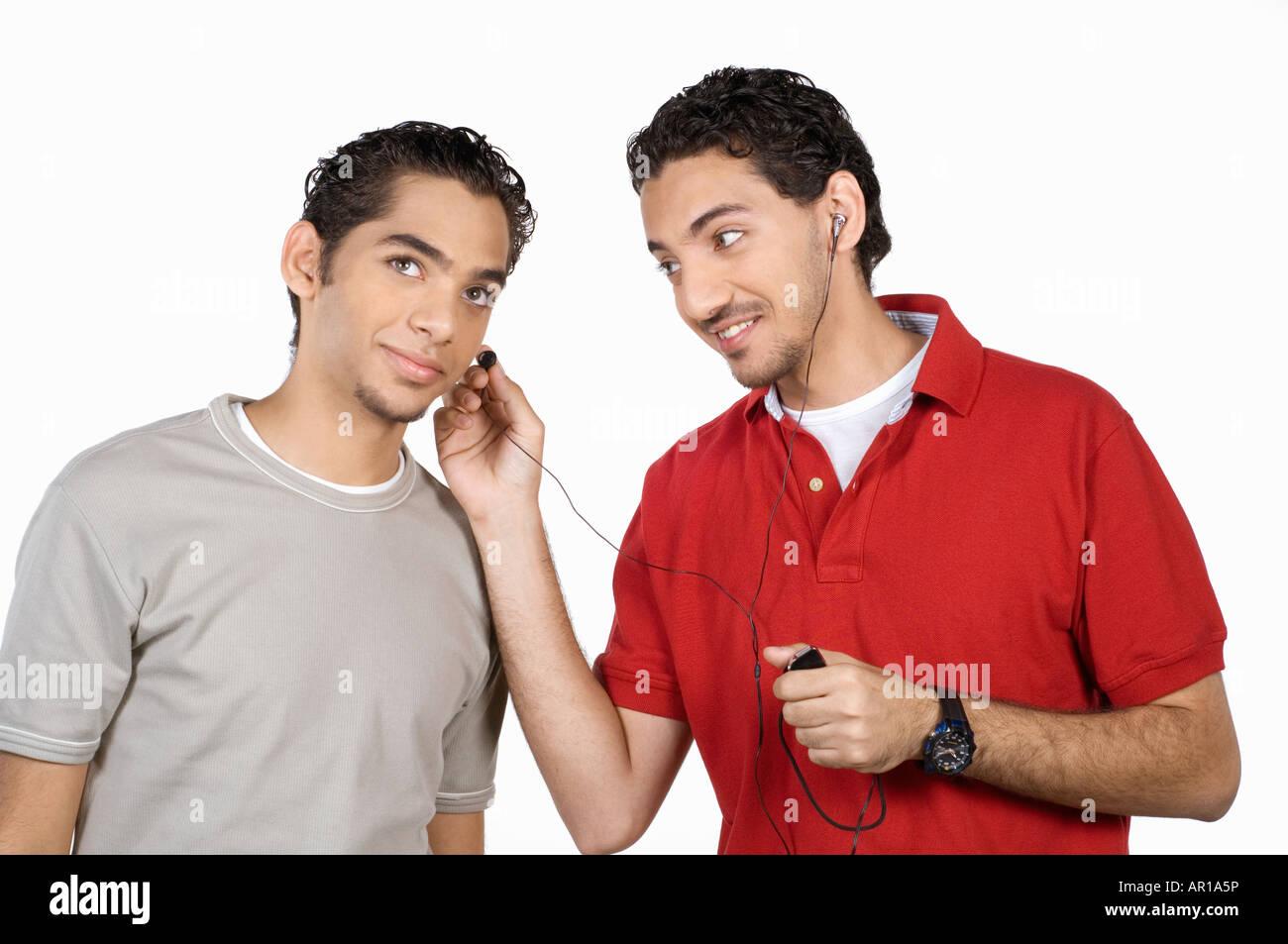 Brothers listening to music Stock Photo - Alamy