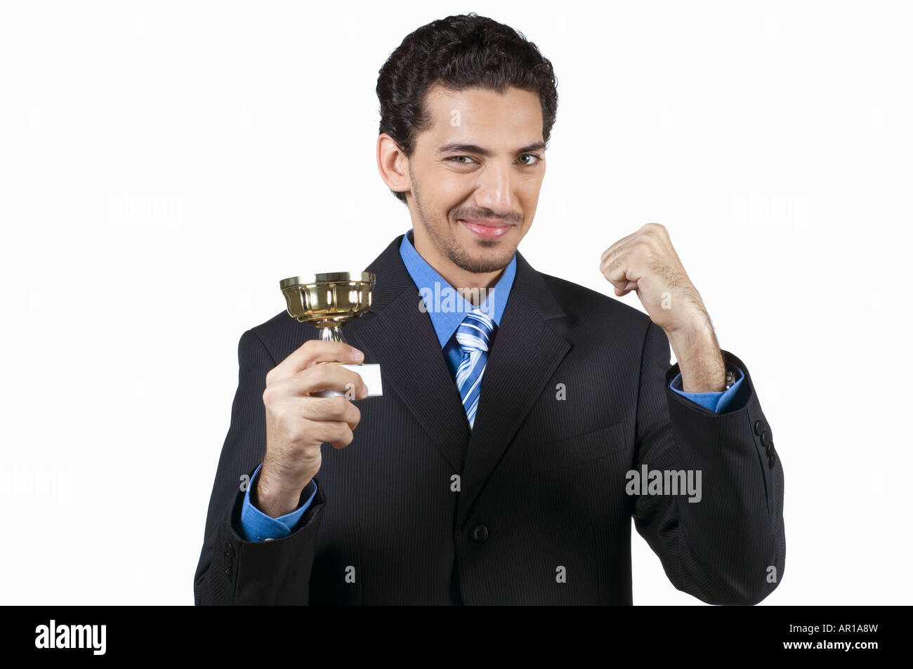 Young happy man with trophy Stock Photo - Alamy