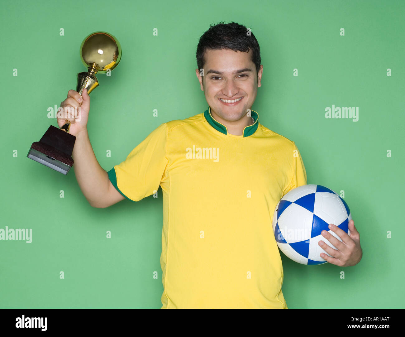 Young happy man with trophy Stock Photo - Alamy