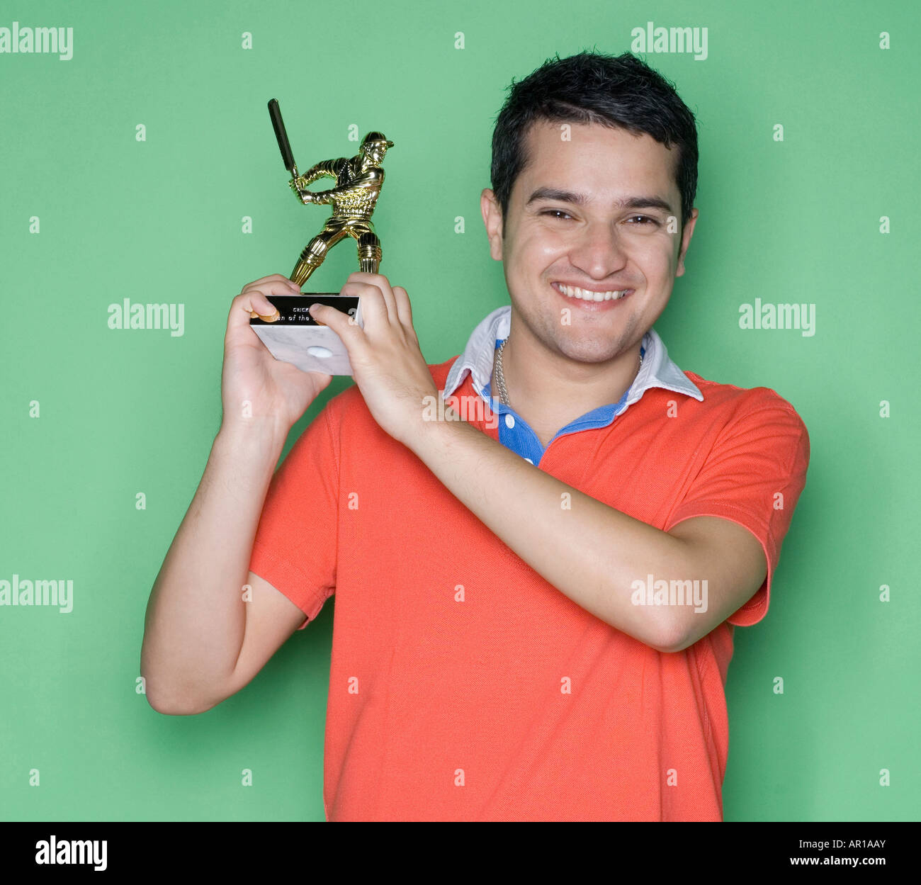 Young happy man with trophy Stock Photo - Alamy