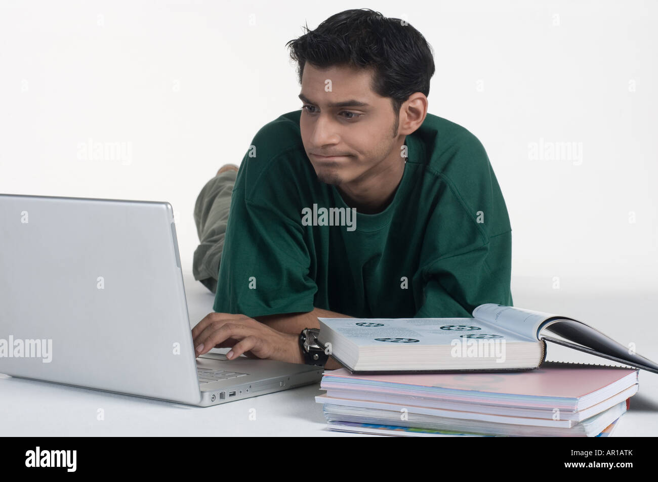 Young man using laptop Stock Photo - Alamy