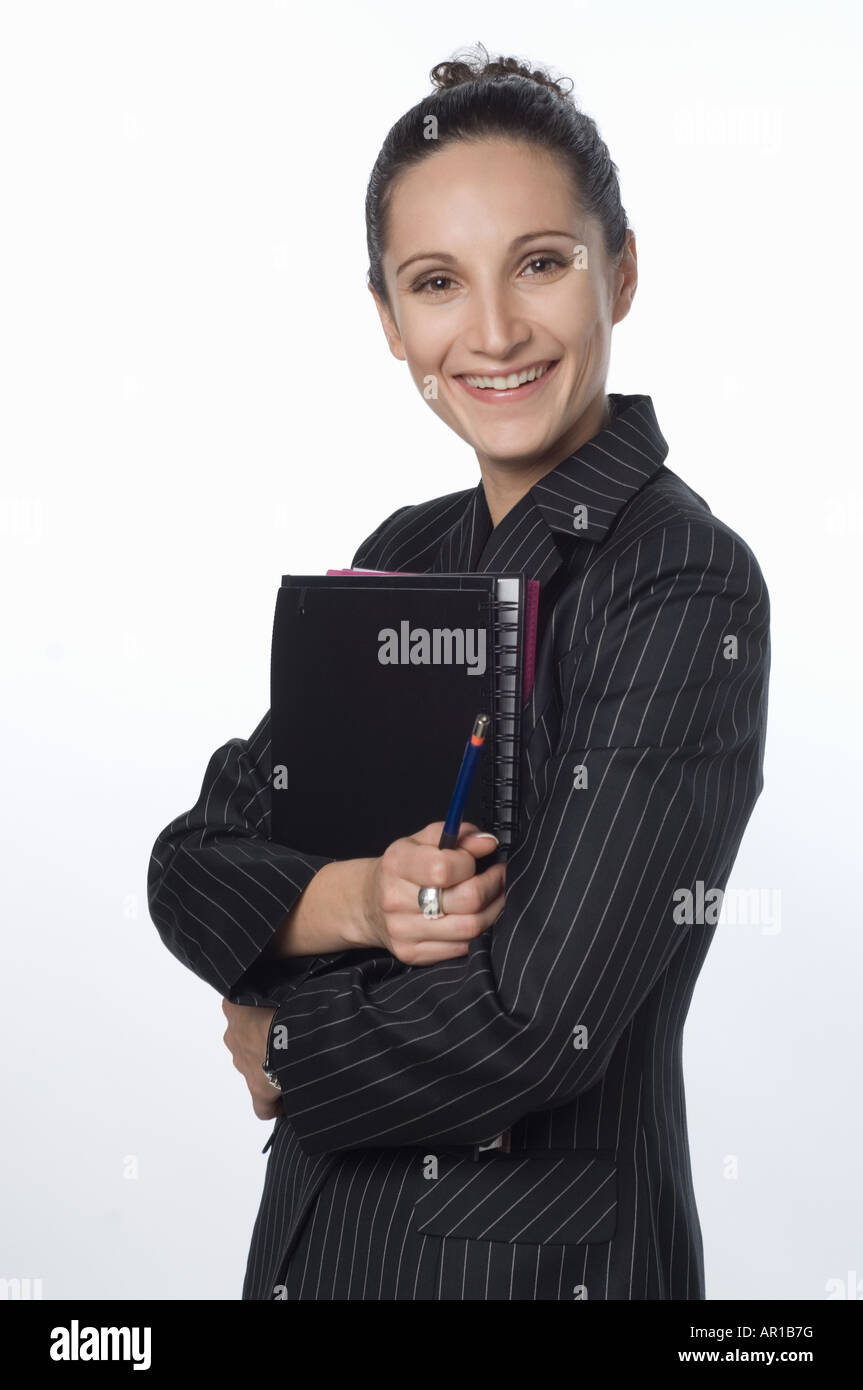 Young woman holding file, portrait Stock Photo - Alamy