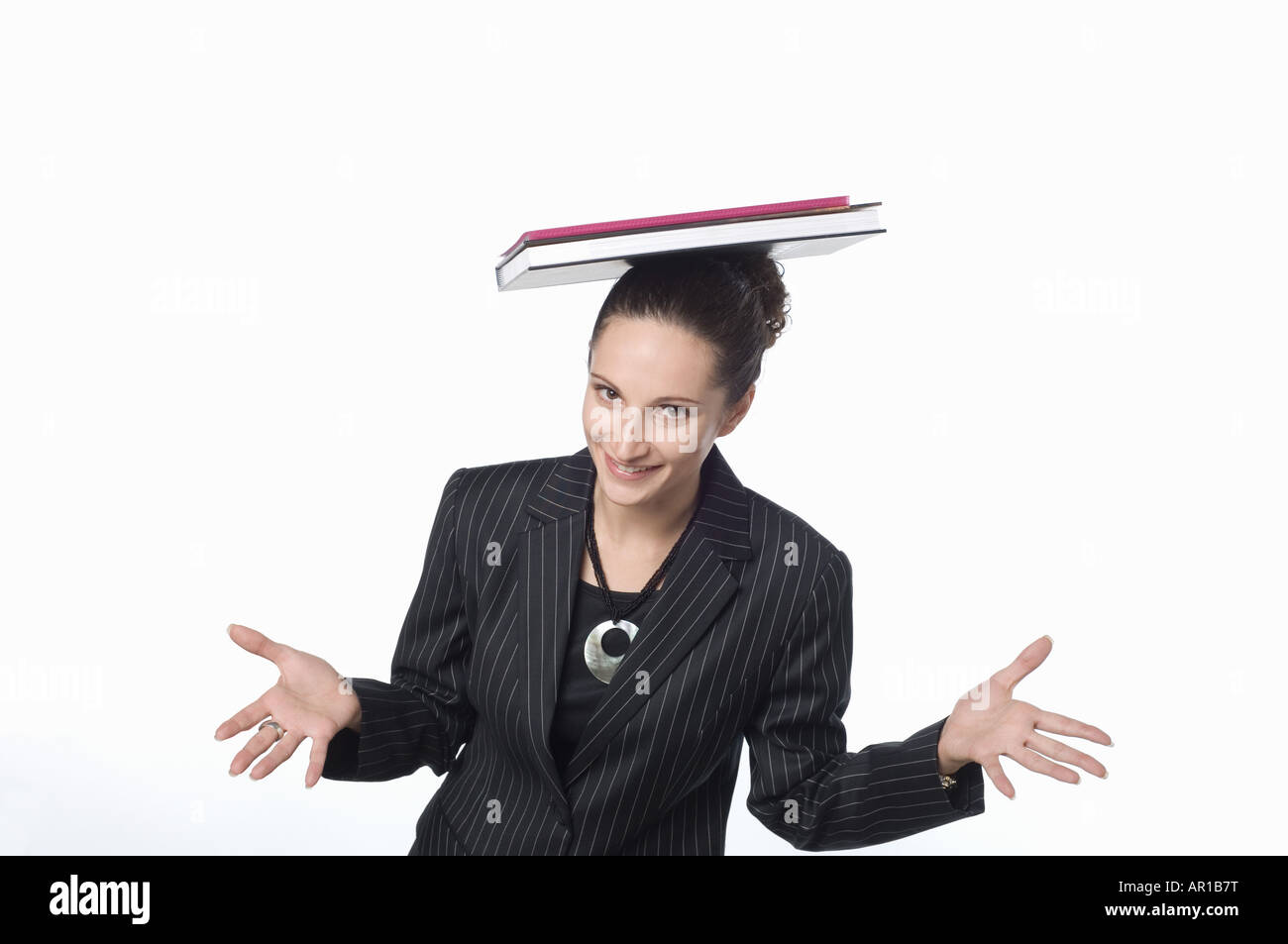 Woman balancing books head hi-res stock photography and images - Alamy