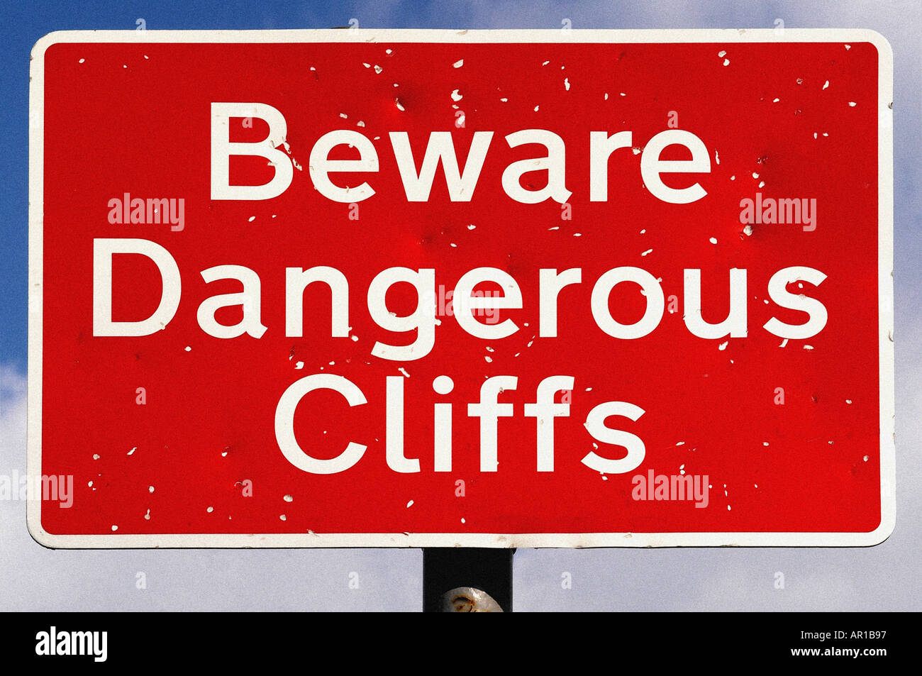 Beware Dangerous Cliffs sign Stock Photo - Alamy