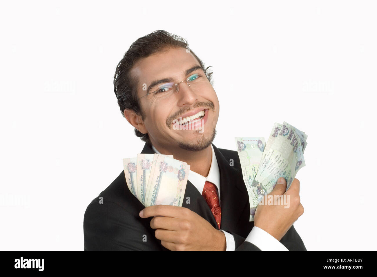 Businessman holding money, smiling, portrait Stock Photo - Alamy