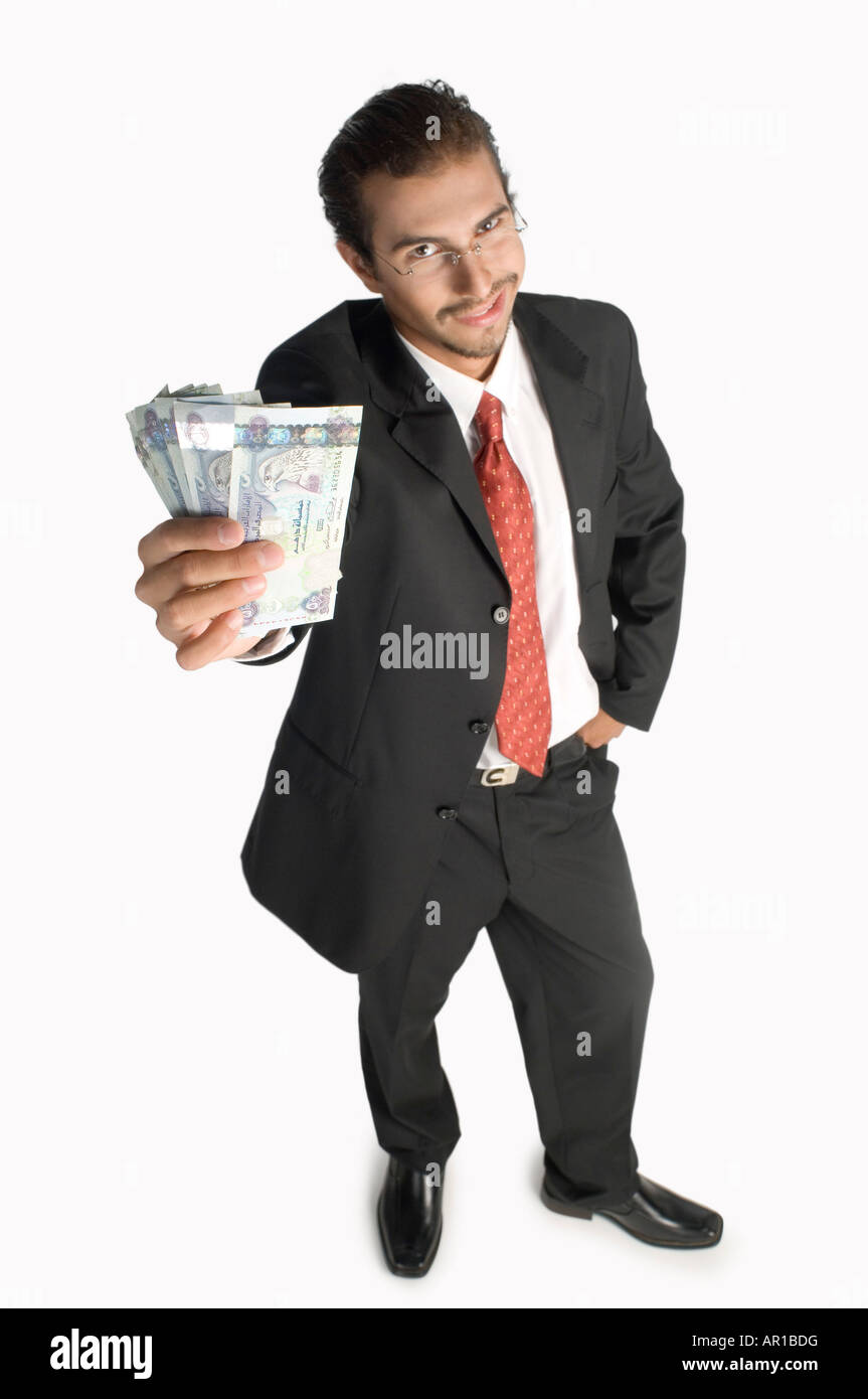 Businessman holding money, portrait, elevated view Stock Photo - Alamy