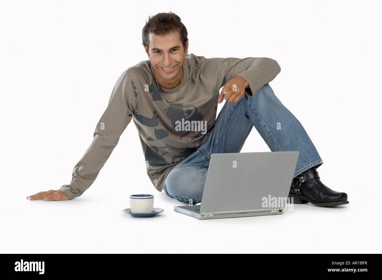 Young man with laptop, smiling, portrait Stock Photo - Alamy