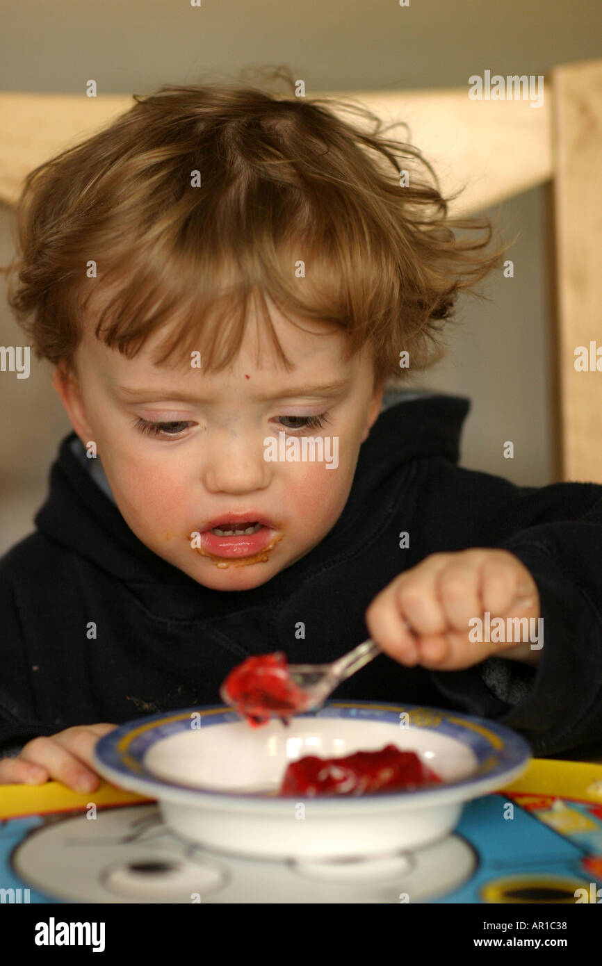 Lewis aged two eating jelly Stock Photo - Alamy