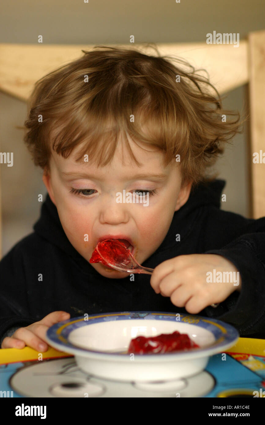 Lewis aged two eating jelly Stock Photo - Alamy