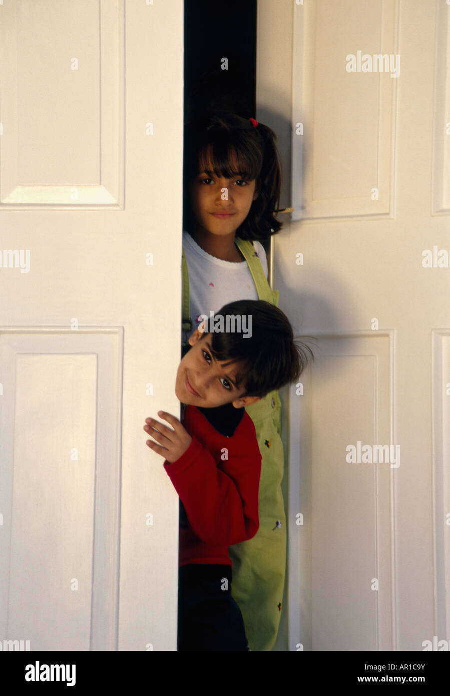 Children waiting at the front door Stock Photo - Alamy