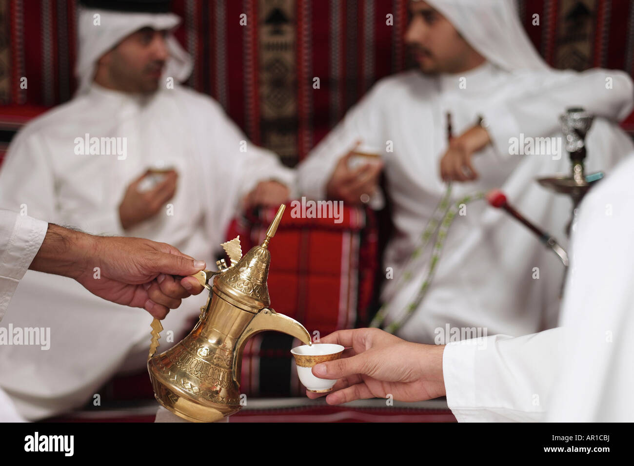 Arab men on a tea session Stock Photo - Alamy