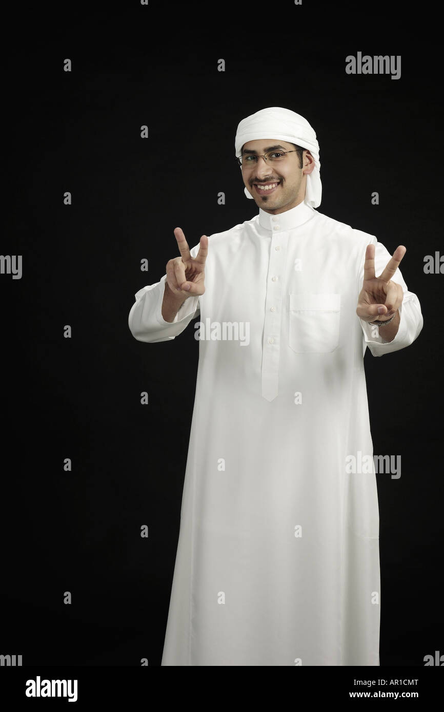Arab man on peace sign Stock Photo - Alamy