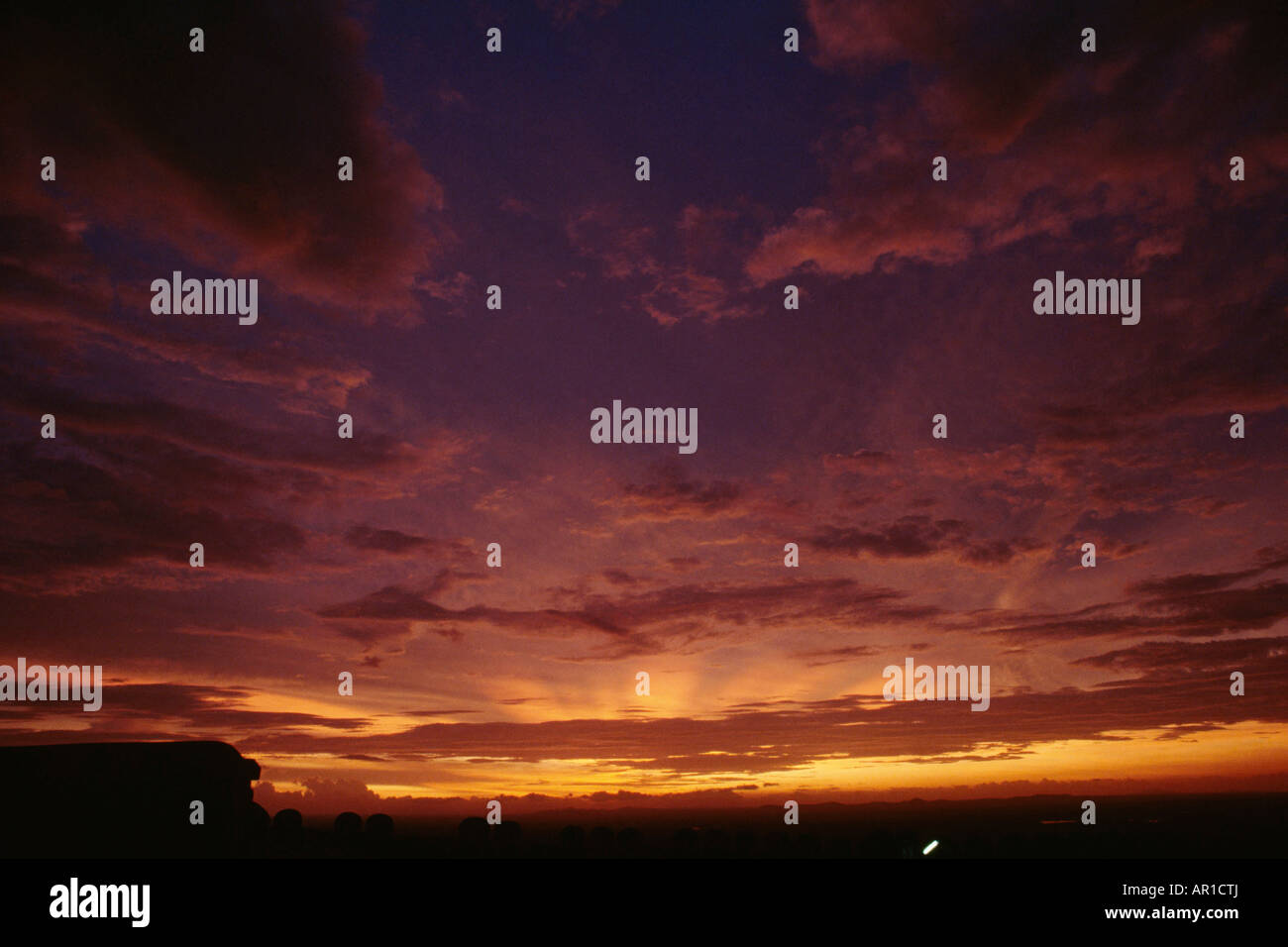 Vast sky is painted with yellow color just after the sunset Stock Photo ...