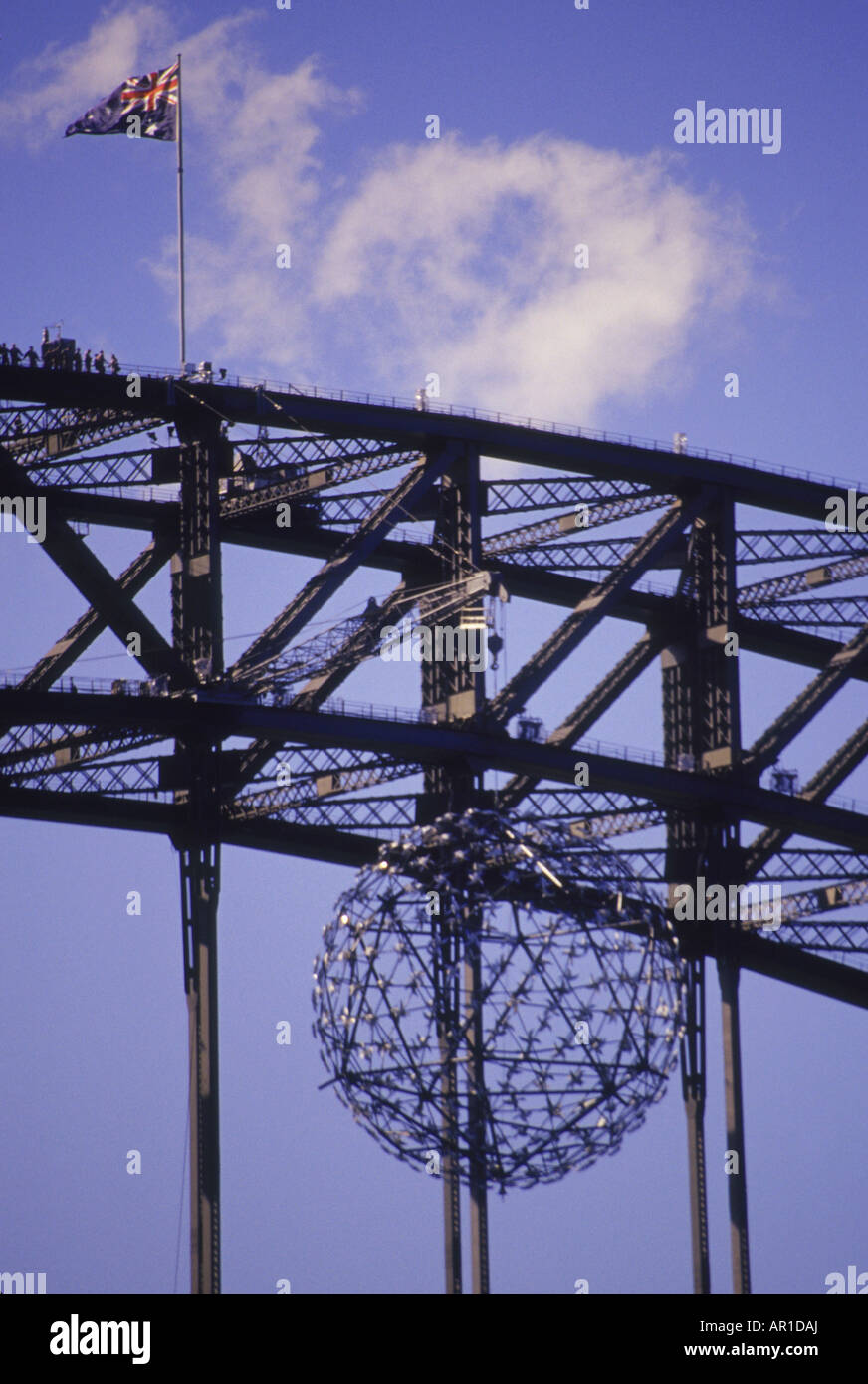 A "bauble" - Christmas decoration - hangs from Sydney Harbour Bridge. A ...