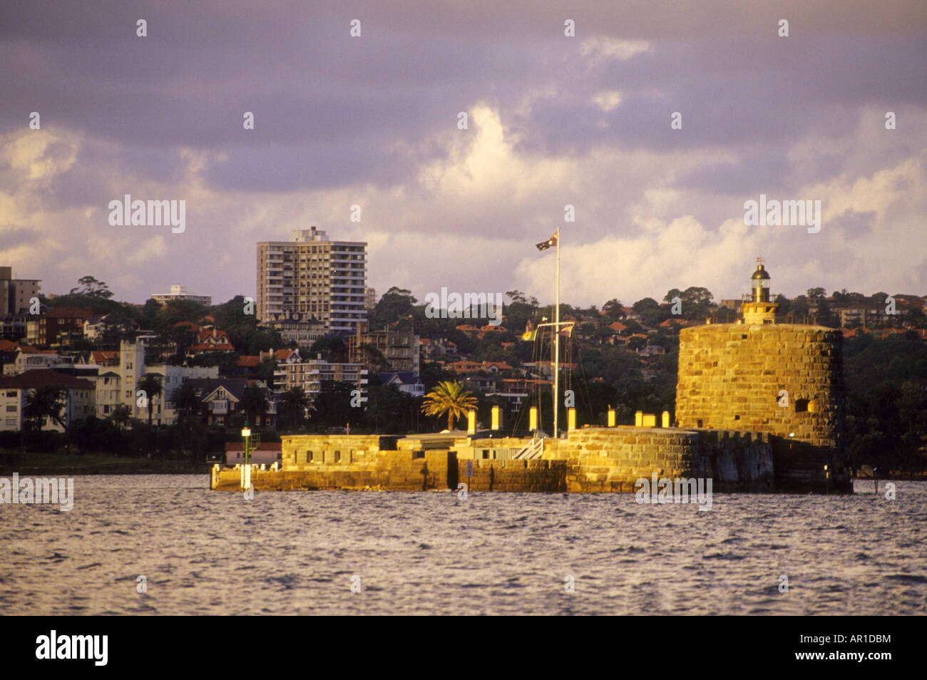 Fort Denison is bathed in sunshine on an otherwise grey day. The fort ...