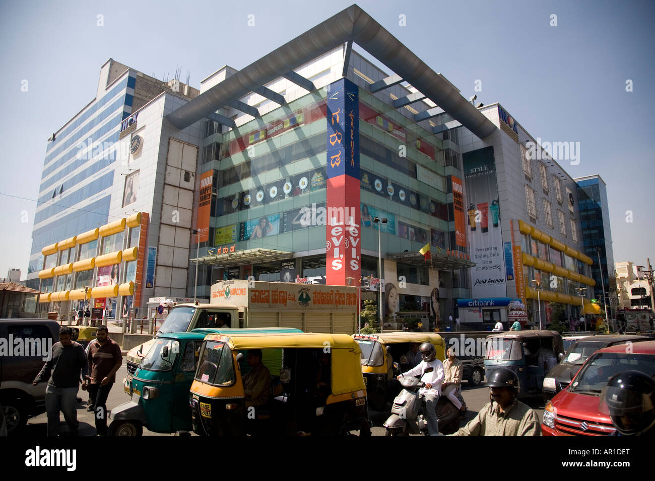 Traffic moves slowly past the Garuda Shopping Mall in Bangalore, South ...